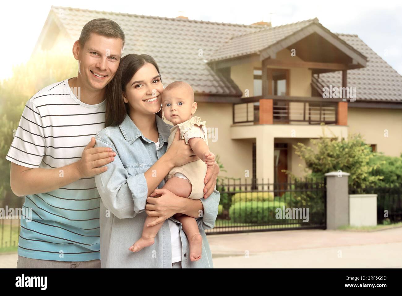 Dream home. Happy family near big beautiful house. Space for text Stock ...