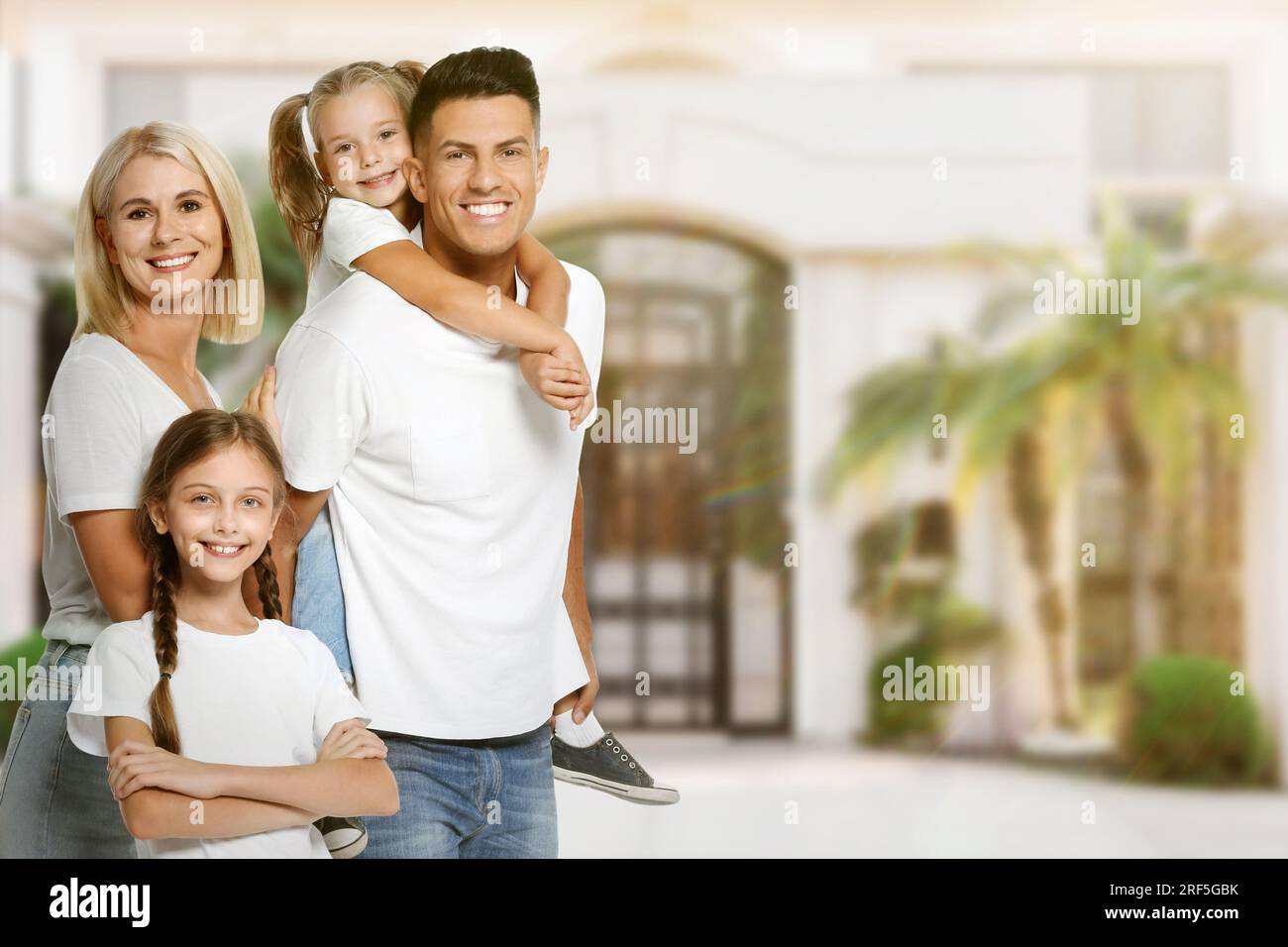 Dream home. Happy family near big beautiful house. Space for text Stock ...