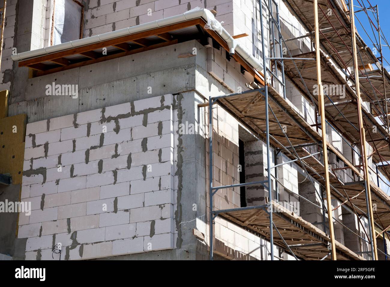building a new home on the building scaffolding for construction and ...