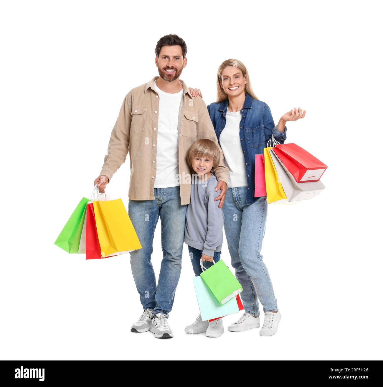 Family shopping. Happy parents and son with many colorful bags on white ...