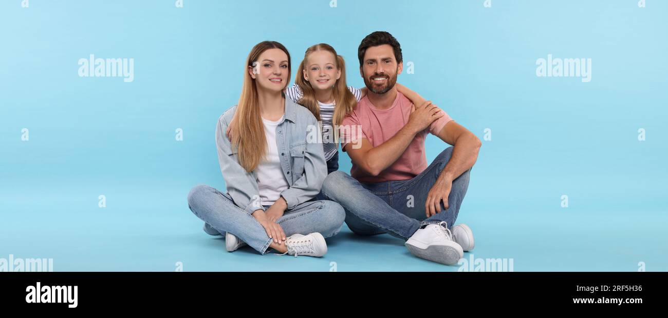 Happy family with child on light blue background. Banner design Stock ...