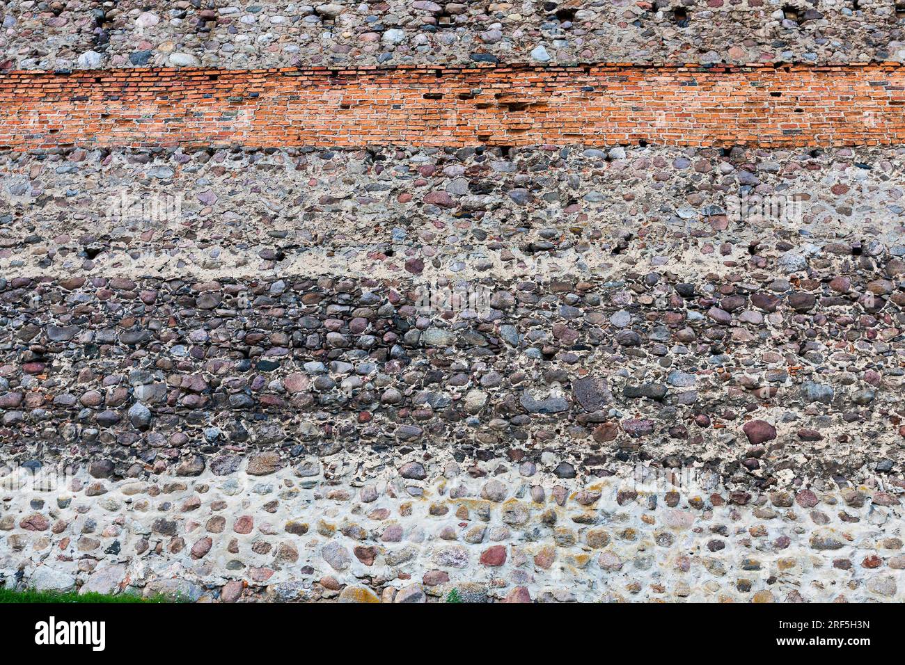 part of the stone wall of a building made in the Middle Ages from ...