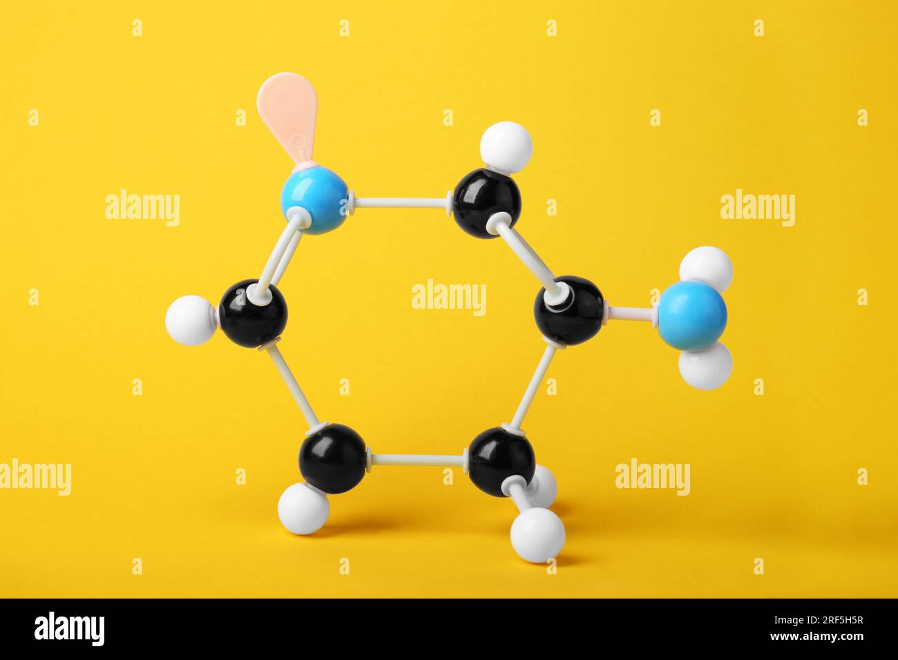 Structure of molecule on yellow background. Chemical model Stock Photo ...