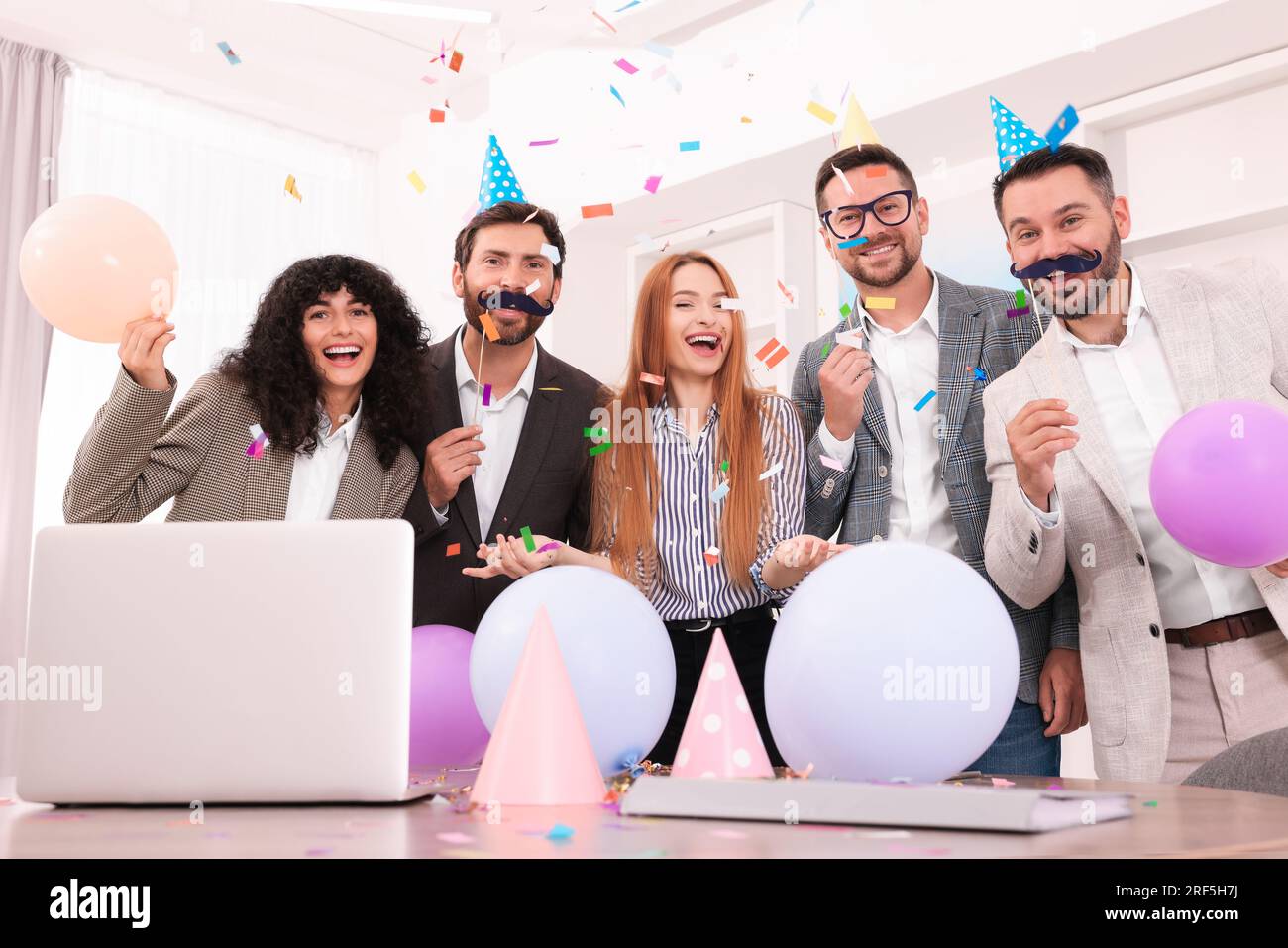 Coworkers having fun during office party indoors Stock Photo - Alamy