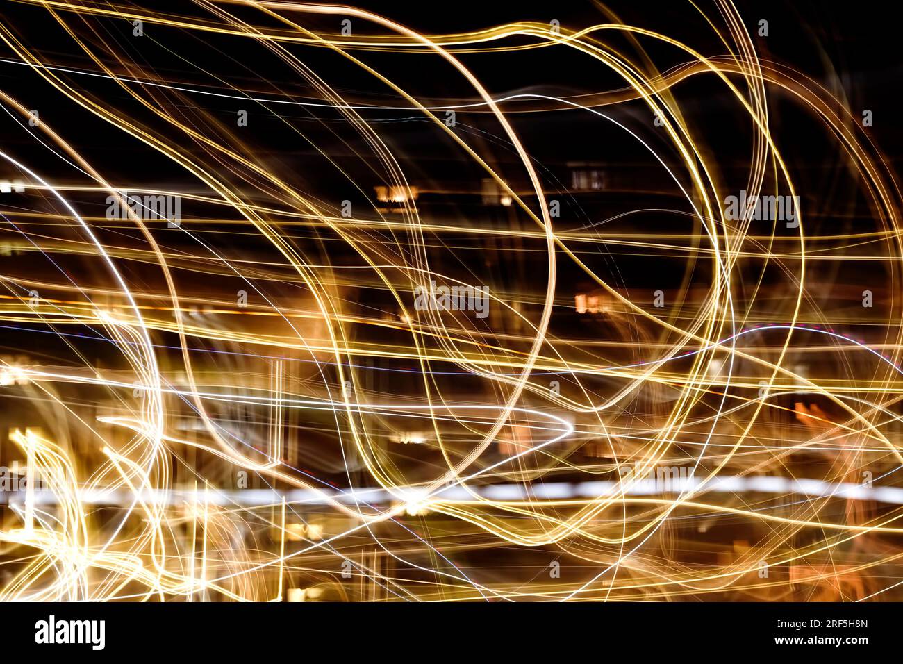 blurred multi colored surface from the rapid movement of glowing ...