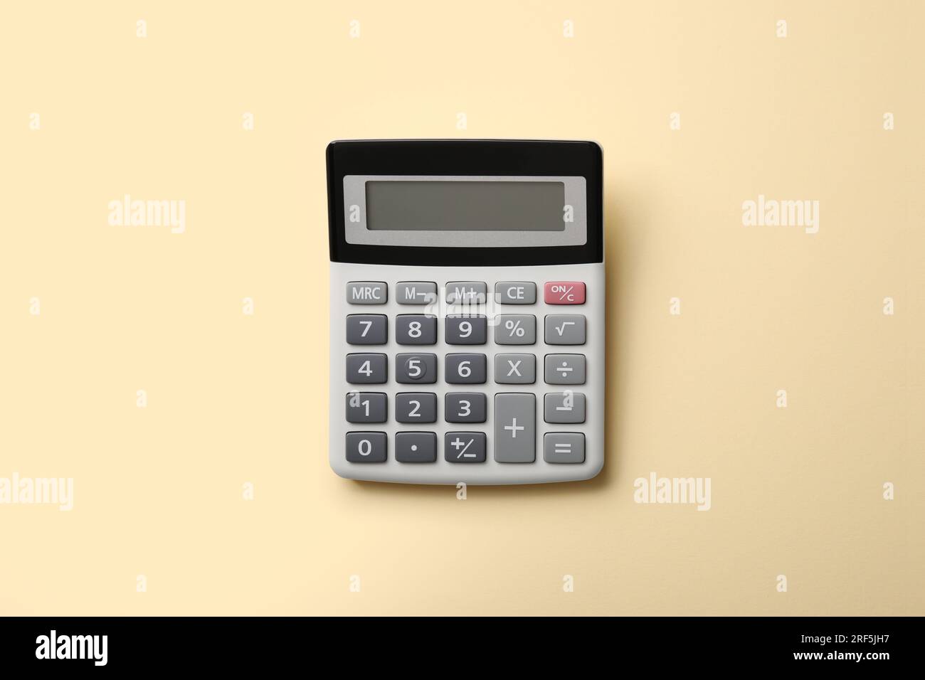 Calculator on beige background, top view. Space for text Stock Photo ...