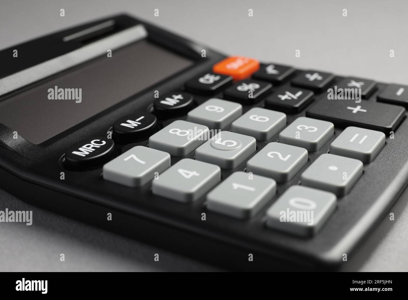 Calculator on grey background, closeup. Office stationery Stock Photo ...
