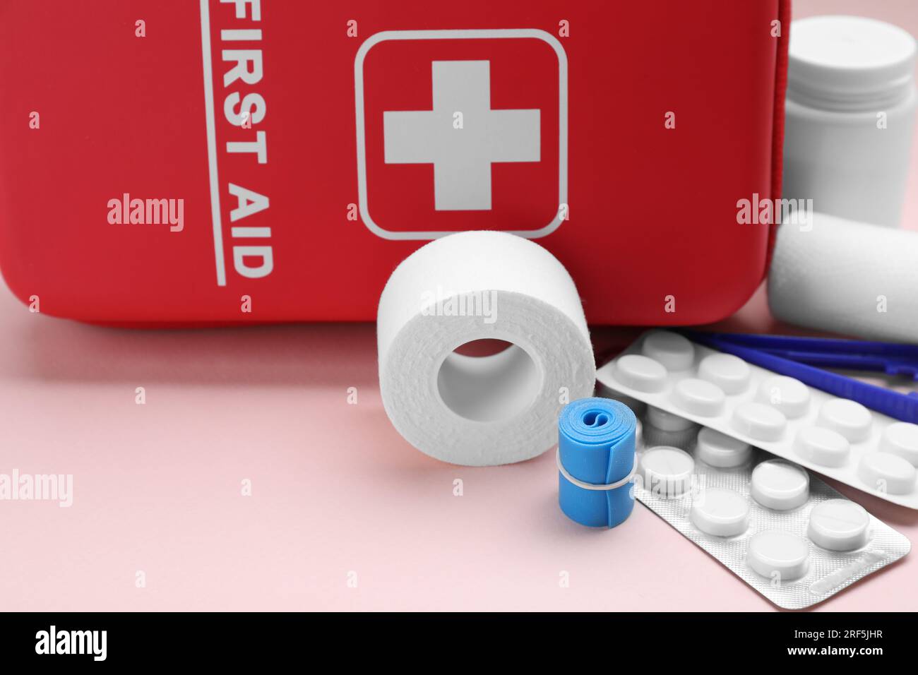 First aid kit on pink background, closeup Stock Photo - Alamy