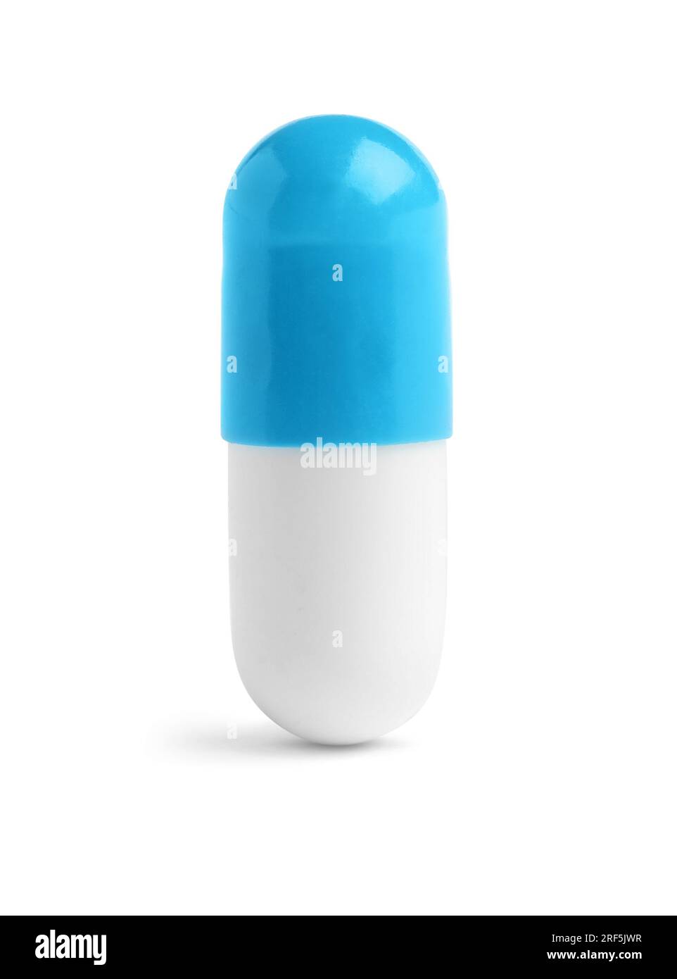 One pill on white background. Medicinal treatment Stock Photo - Alamy