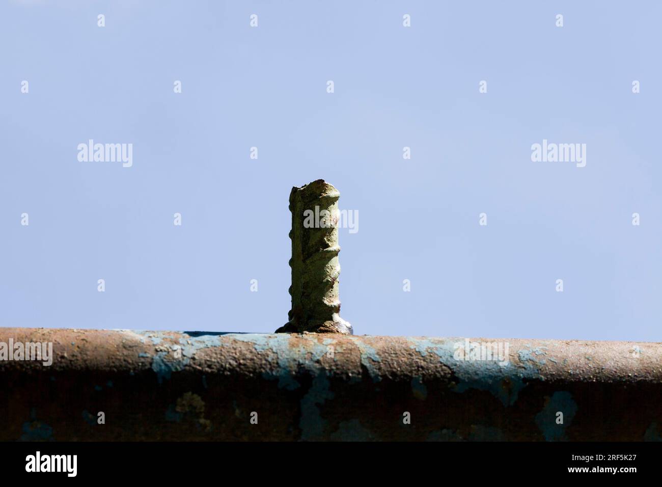 the part of the metal surface with protruding pieces of rebar that was ...