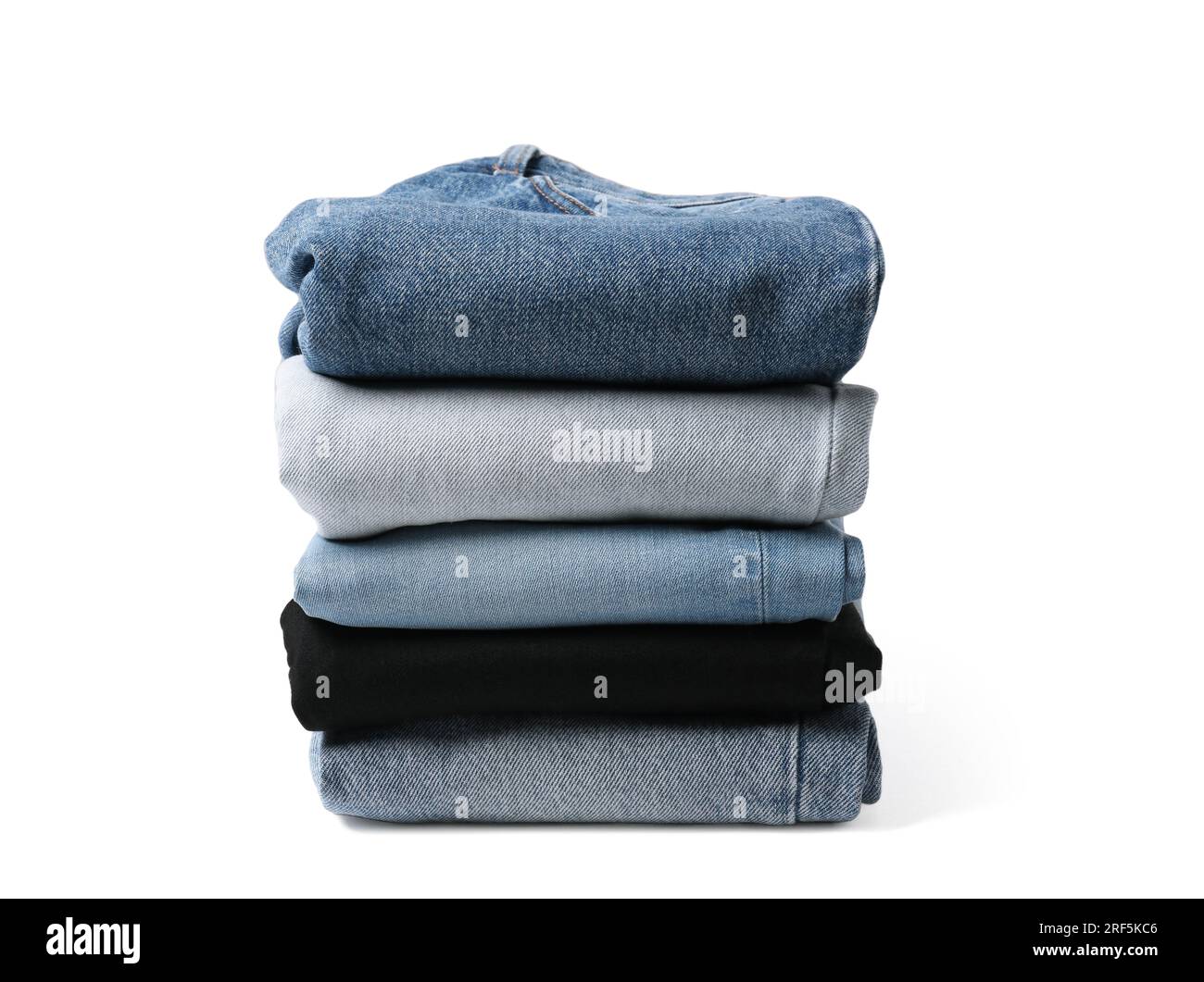 Stack of different folded jeans isolated on white Stock Photo - Alamy