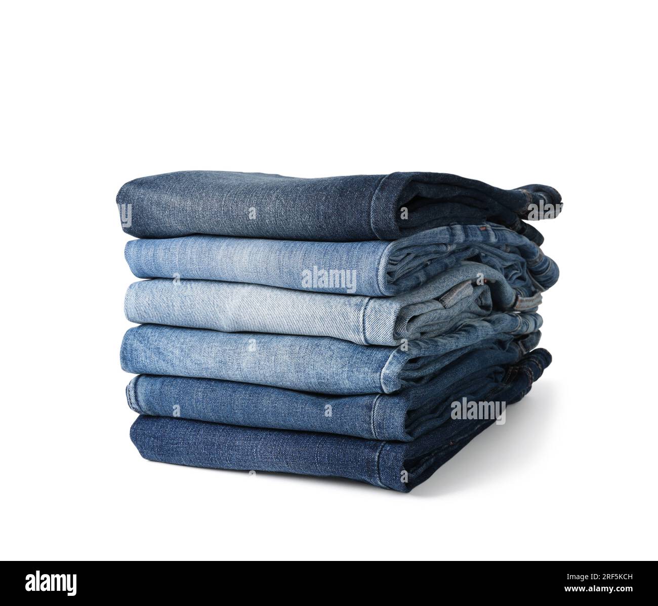 Stack of different folded jeans isolated on white Stock Photo - Alamy