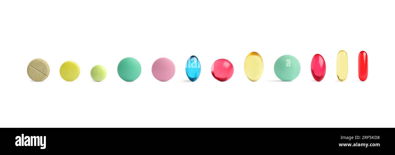 Set of different color pills in row isolated on white Stock Photo - Alamy