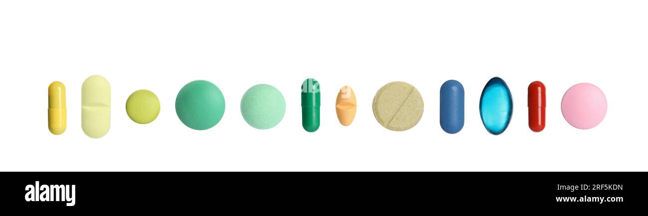 Set of different color pills in row isolated on white Stock Photo - Alamy