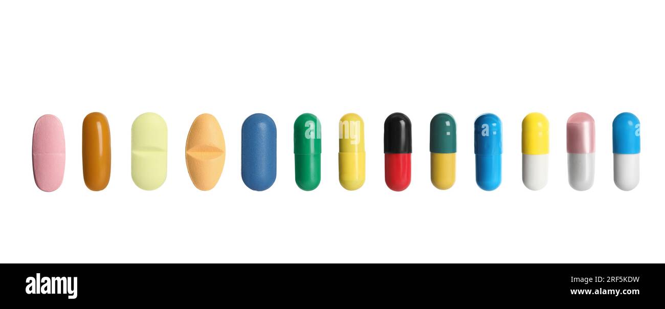 Set of different color pills in row isolated on white Stock Photo - Alamy