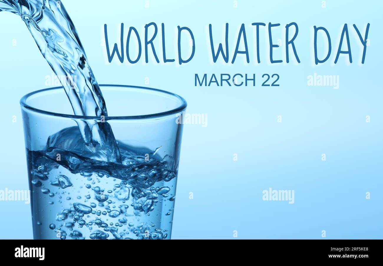 Text World Water Day, March 22 and pouring water into glass on light ...