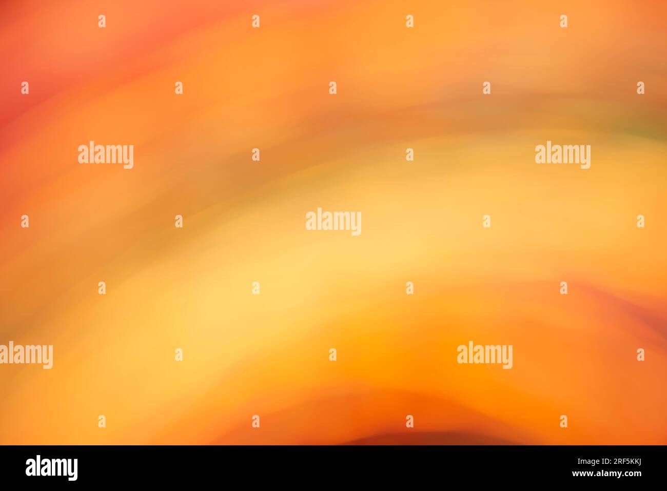 Artistic abstract warm background in vivid orange and yellow colors ...