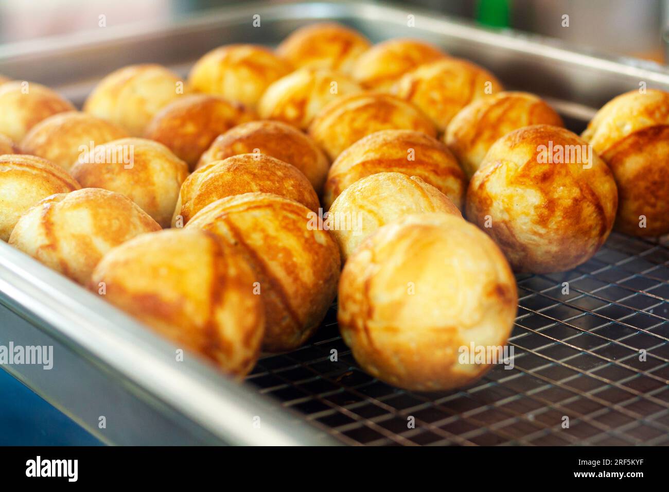 Aebleskiver, traditional Danish fried batter snacks Stock Photo - Alamy