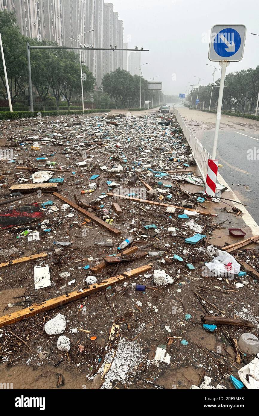 Photo taken on July 31, 2023, shows a road strewn with rubble following ...