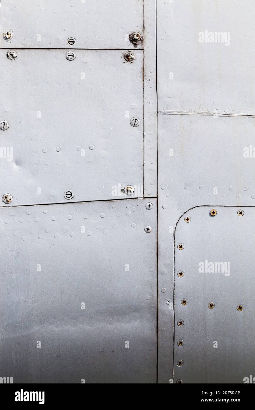 aluminum sheets joined together by welding and riveting, close up of ...