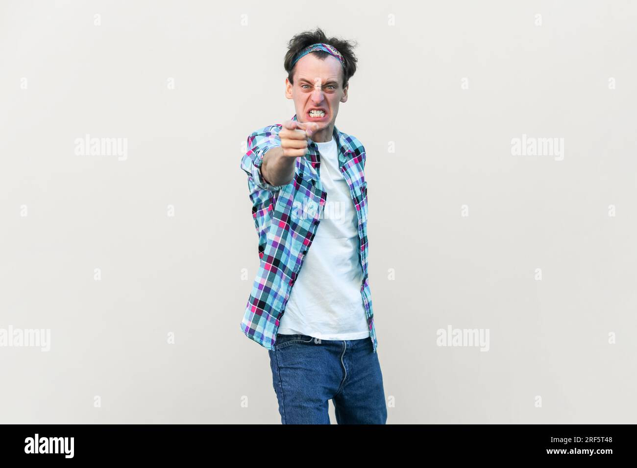 Furious angry man looses temper, screams and points at you, blames ...