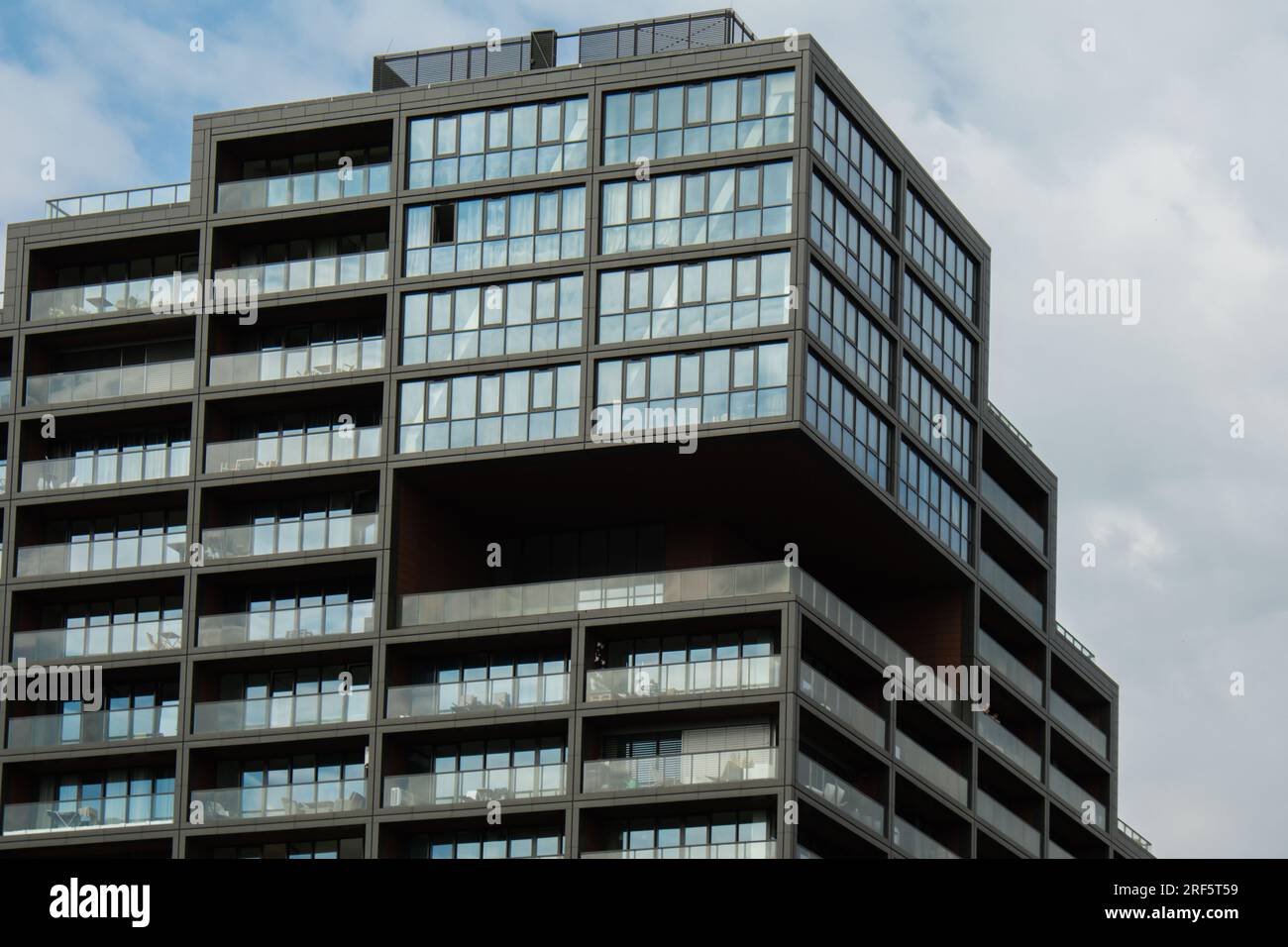 Modern glass office building exterior with glass facade on clear sky ...