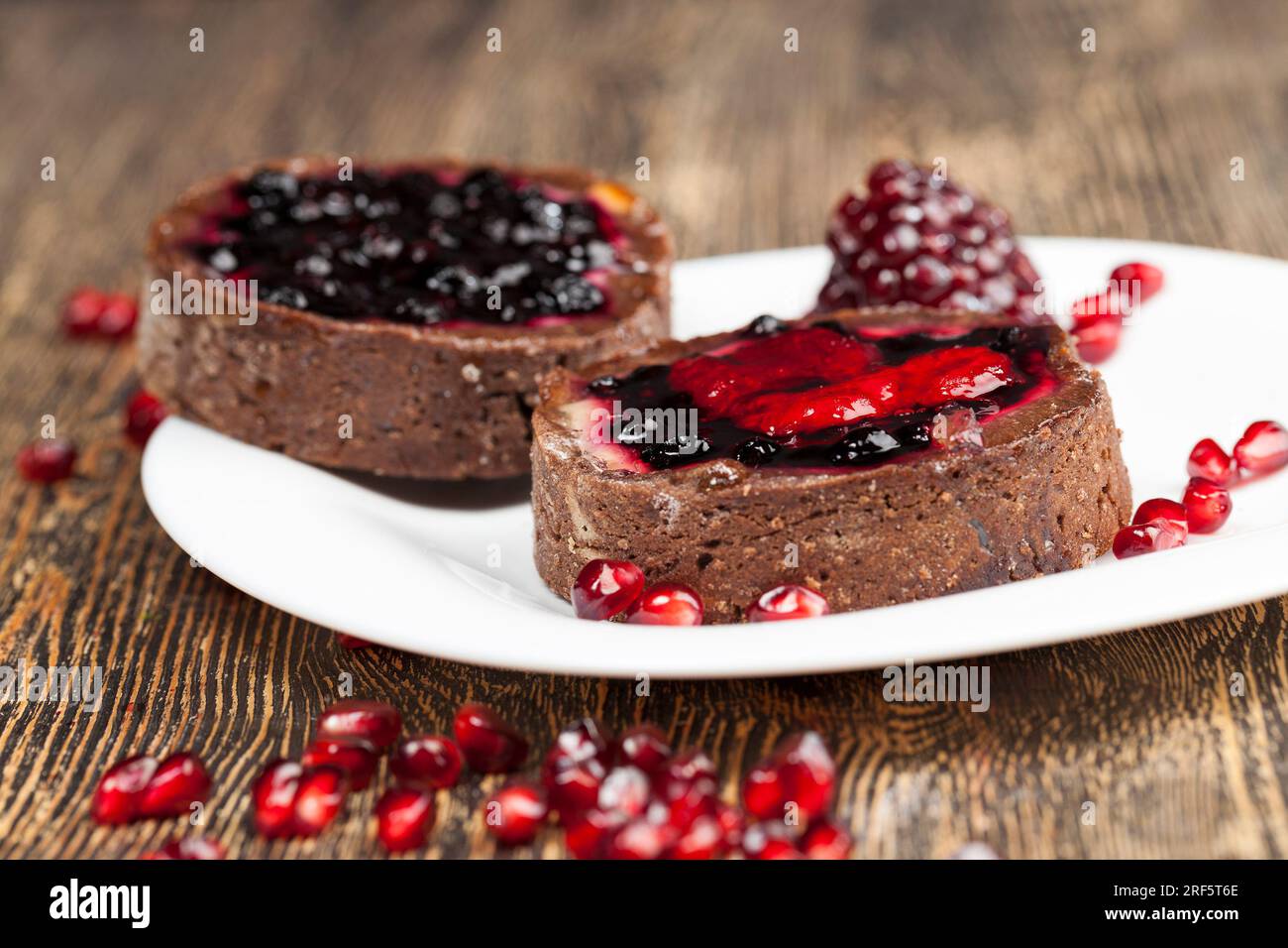 round tartlet with strawberries and blueberries in butter cream, baked ...