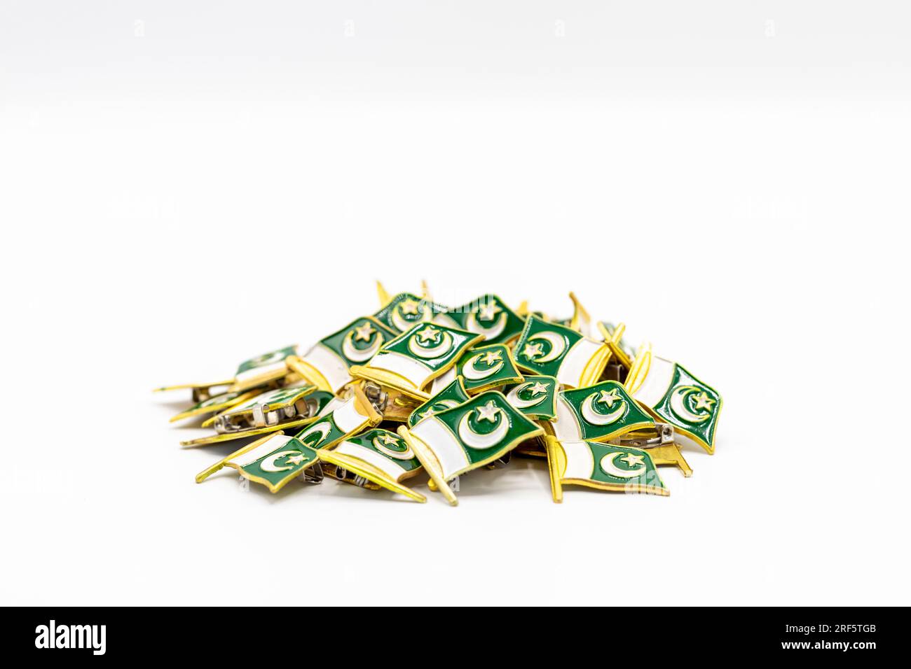 close up of Pakistan flag pins badges on white isolated background ...