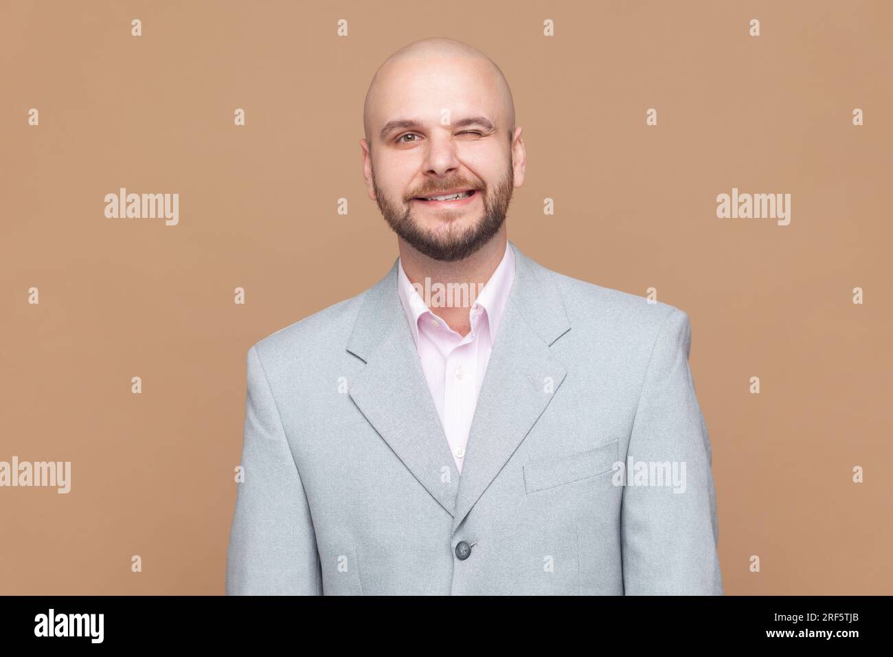 Portrait of playful positive optimistic bald bearded man has fun and ...