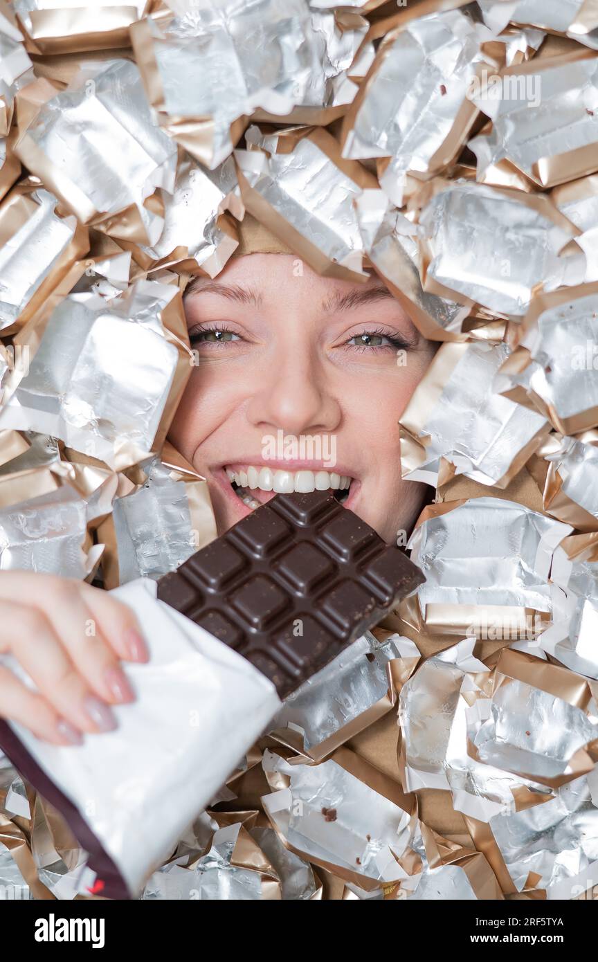 Eating chocolates wrappers hi-res stock photography and images - Alamy