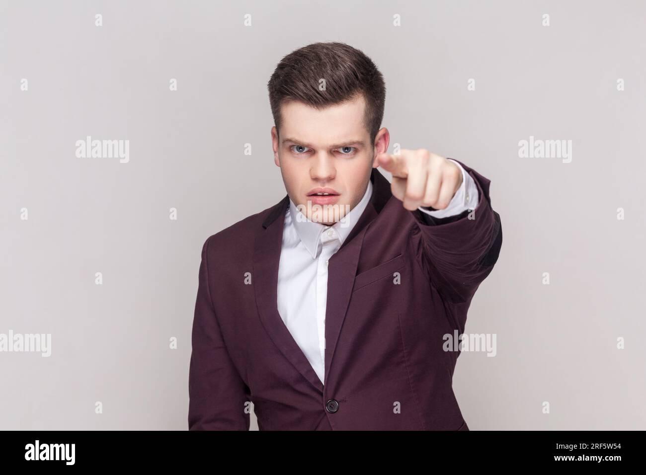 Serious strict handsome handsome young man looks angrily or with ...