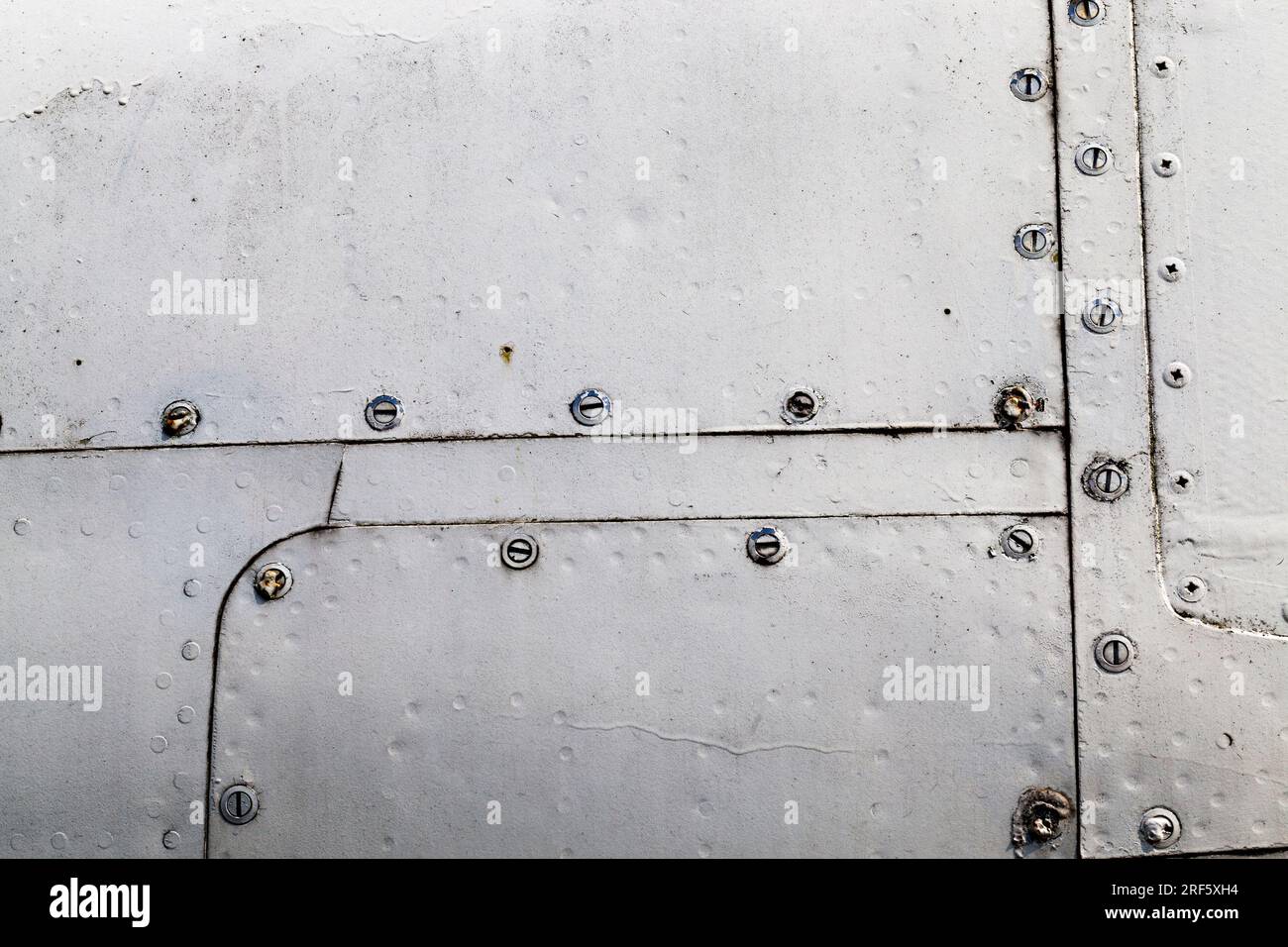 aluminum sheets joined together by welding and riveting, close up of ...