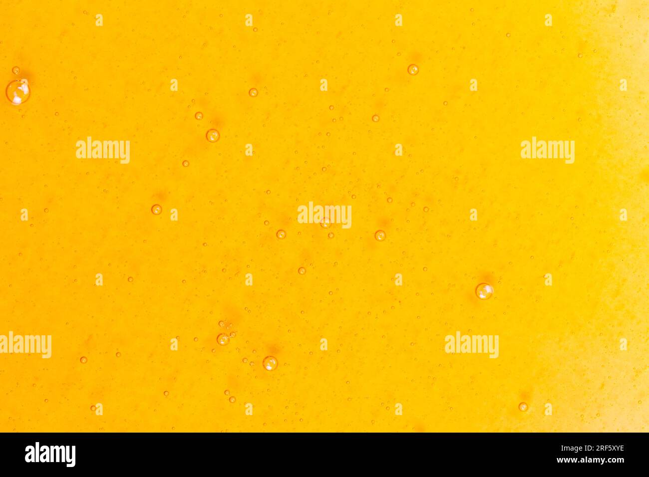 beautiful background of thick and sweet honey with air bubbles, close ...
