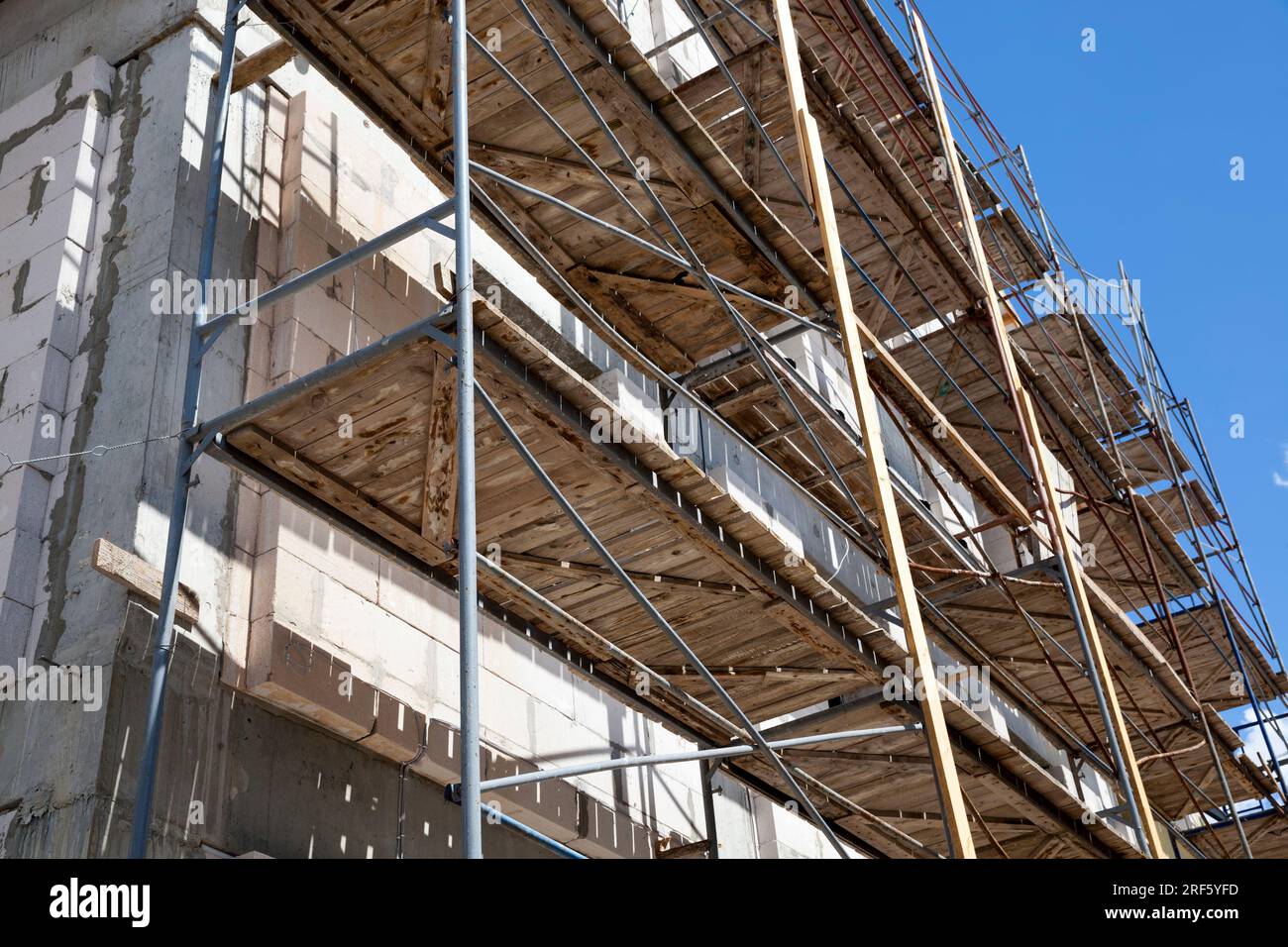 building a new home on the building scaffolding for construction and ...