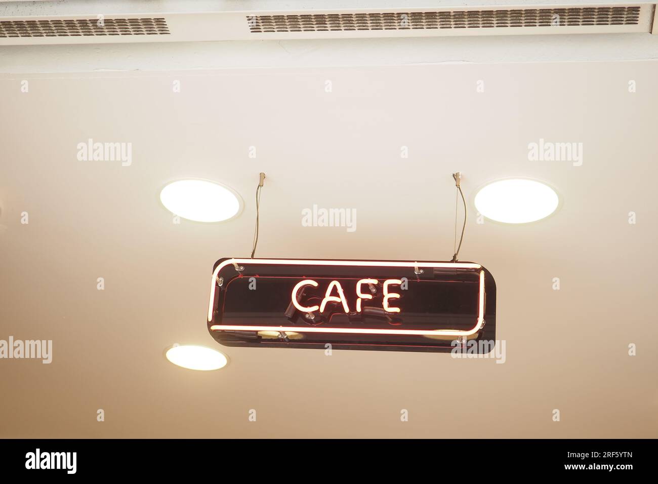 Glowing neon sign with words cafe Stock Photo - Alamy