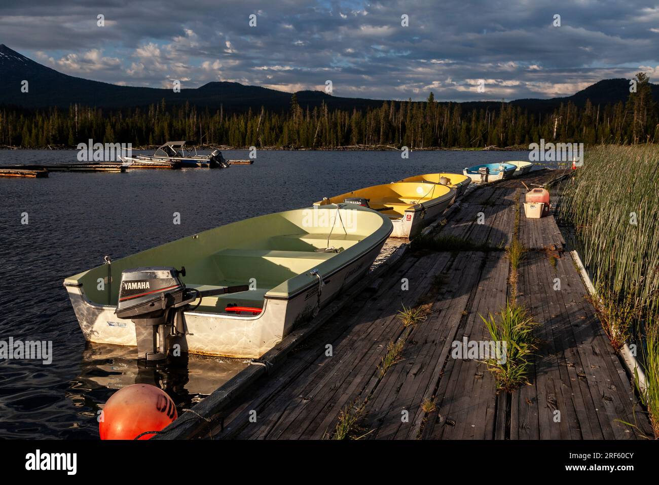 Motorboats line the dock at Lava Lake in the Cascade Lakes region near ...