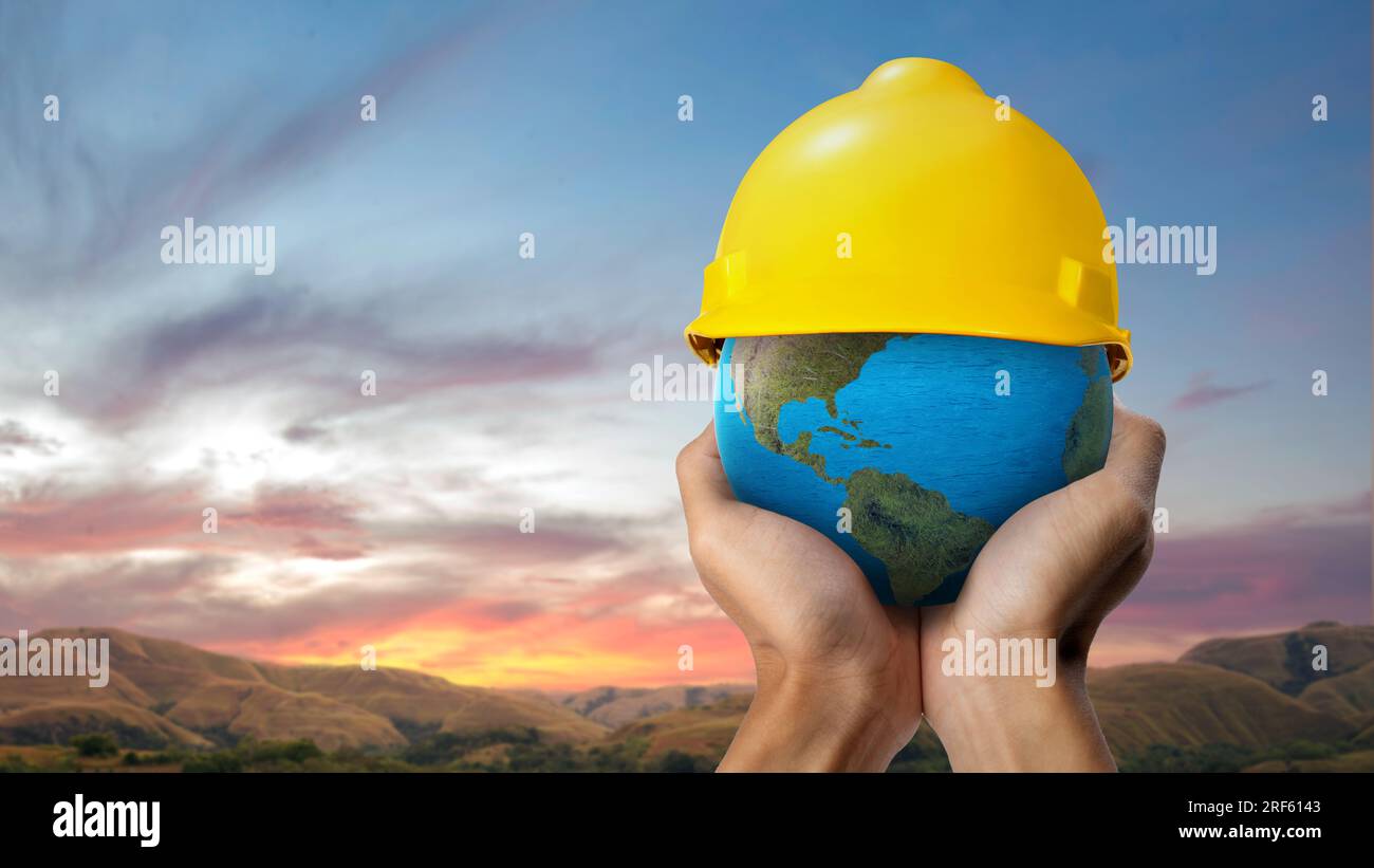 Globe with safety helmet. Labor day concept Stock Photo - Alamy