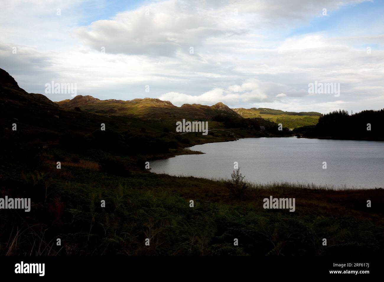 Colour photograph of a lake and hills at sunset, Capel Curig, Snowdonia ...