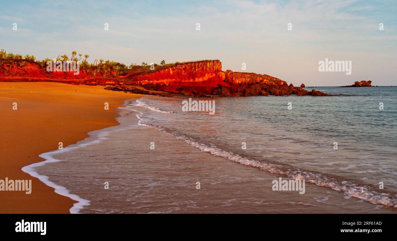 Rugged rocks around Mercedes Cove on Pender Bay at sunrise Stock Photo ...