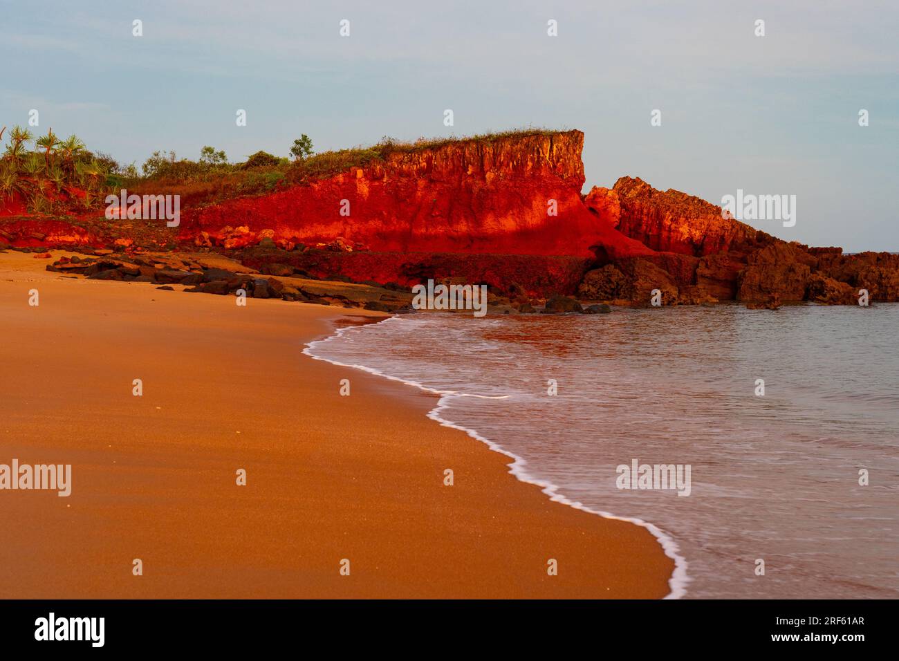 Rugged rocks around Mercedes Cove on Pender Bay at sunrise Stock Photo ...