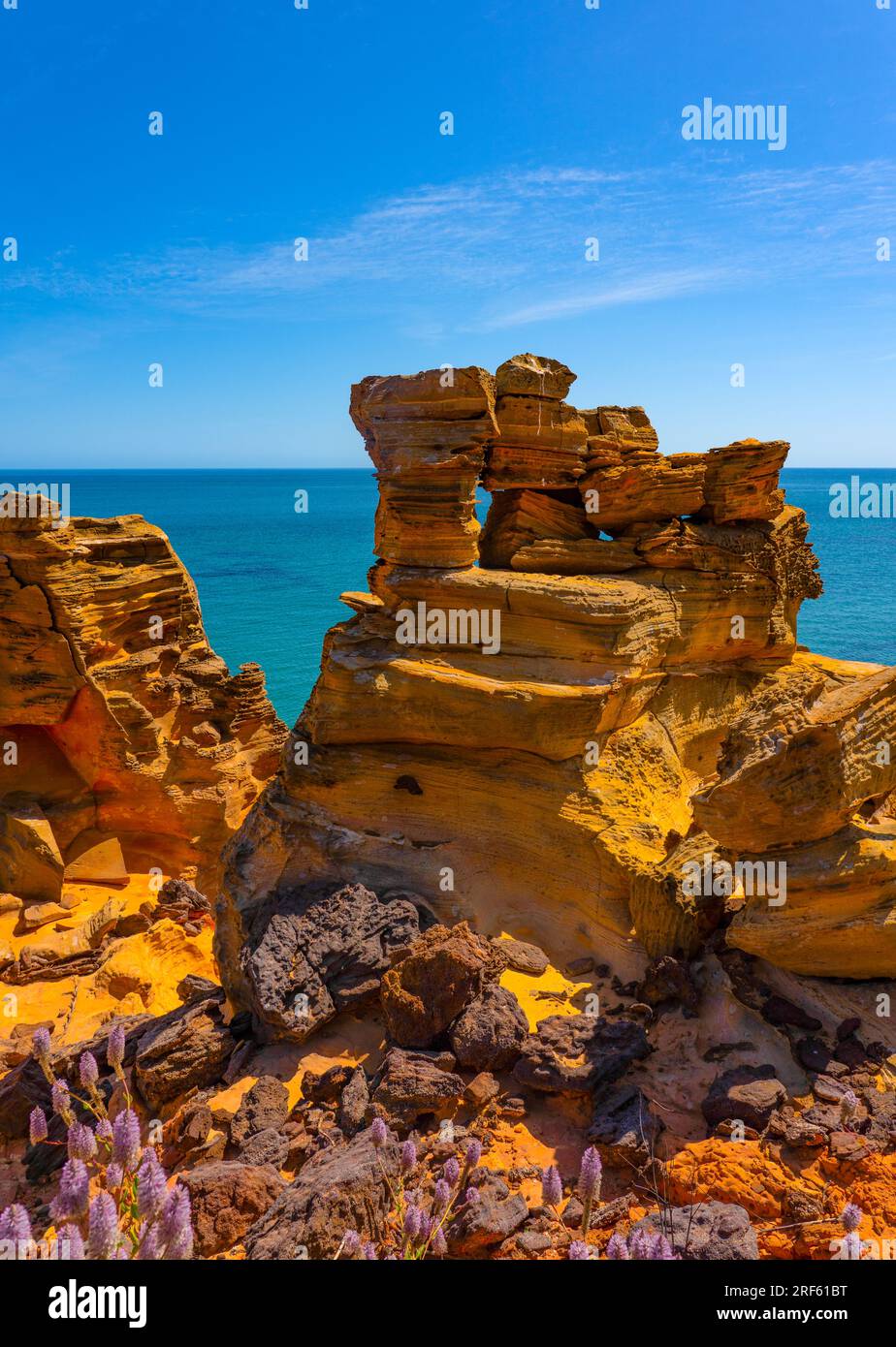 A jumble of tumbled and eroded rocks on clifftop at Mercedes Cove on ...