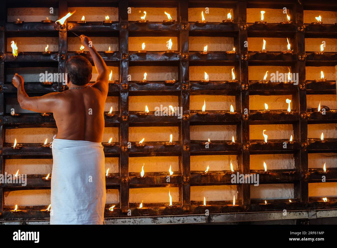 Kerala, India. 01st Aug, 2023. Devotees help lighting up the 10,000 ...