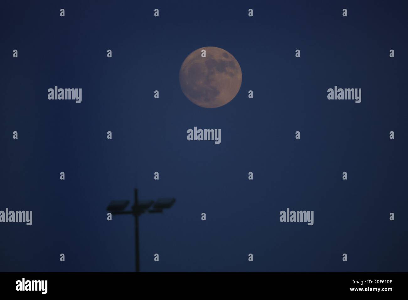DALLAS, TX, USA. 31st July, 2023. A full moon is seen in contrast to an ...