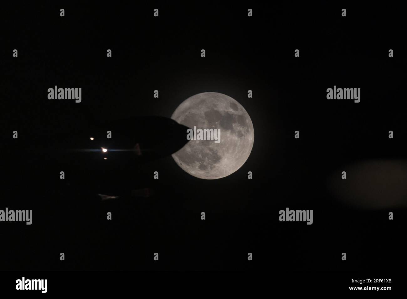 DALLAS, TX, USA. 31st July, 2023. A full moon is seen in contrast to an ...