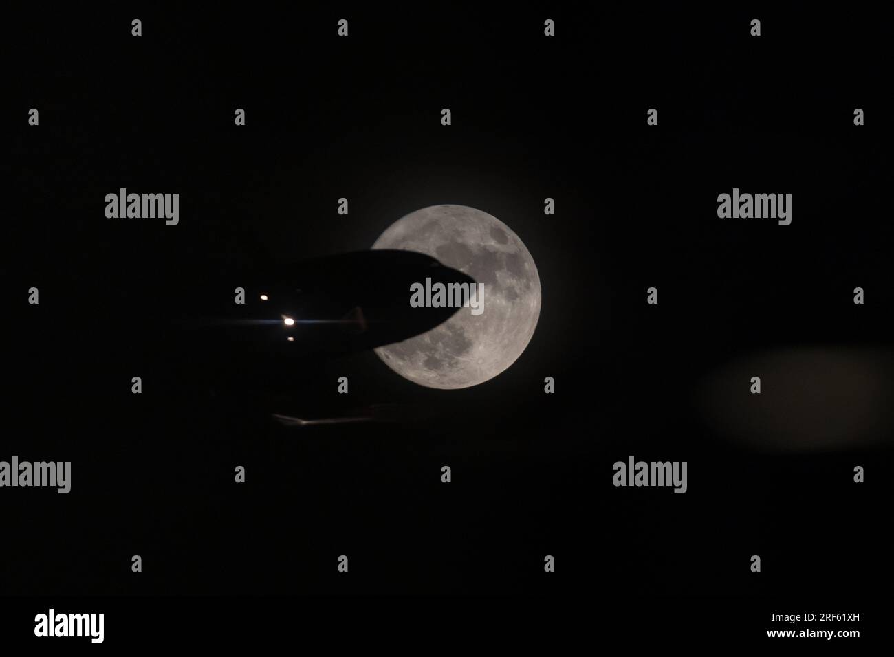 DALLAS, TX, USA. 31st July, 2023. A full moon is seen in contrast to an ...