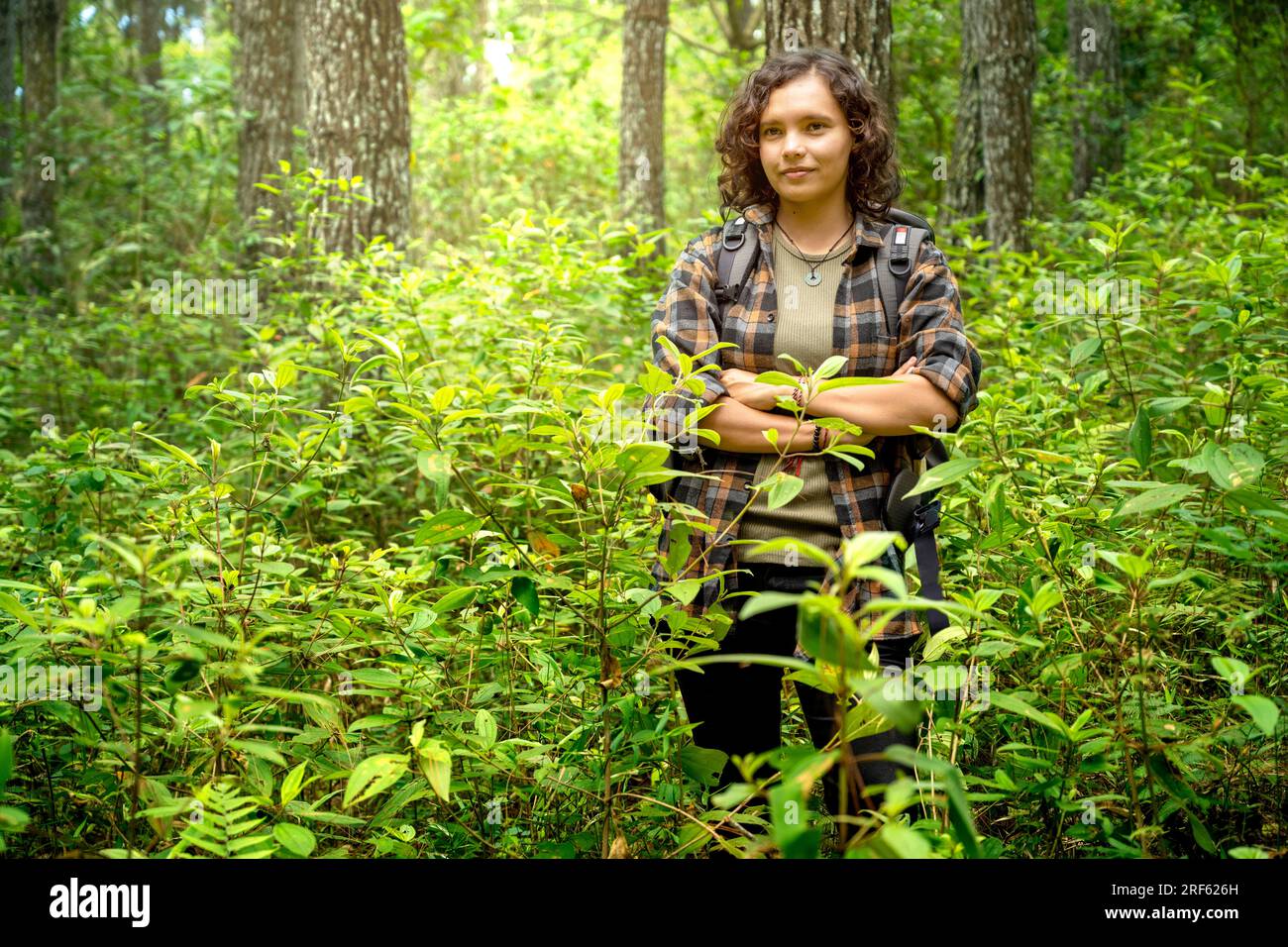 Asian woman trekking in the forest. Traveling activity Stock Photo - Alamy