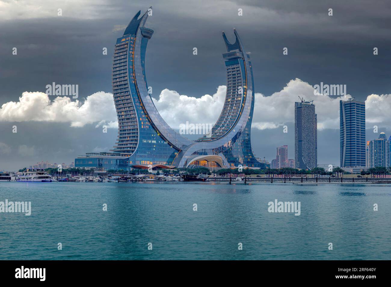 Katara buildings view from Lusail Marina Park. Crescent Tower Stock ...