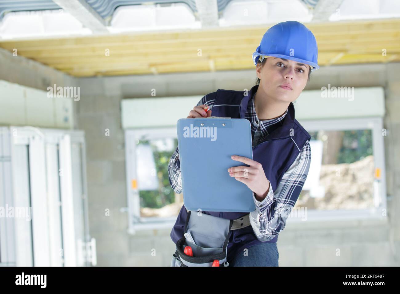 female builder engineer checking construction site standards Stock ...