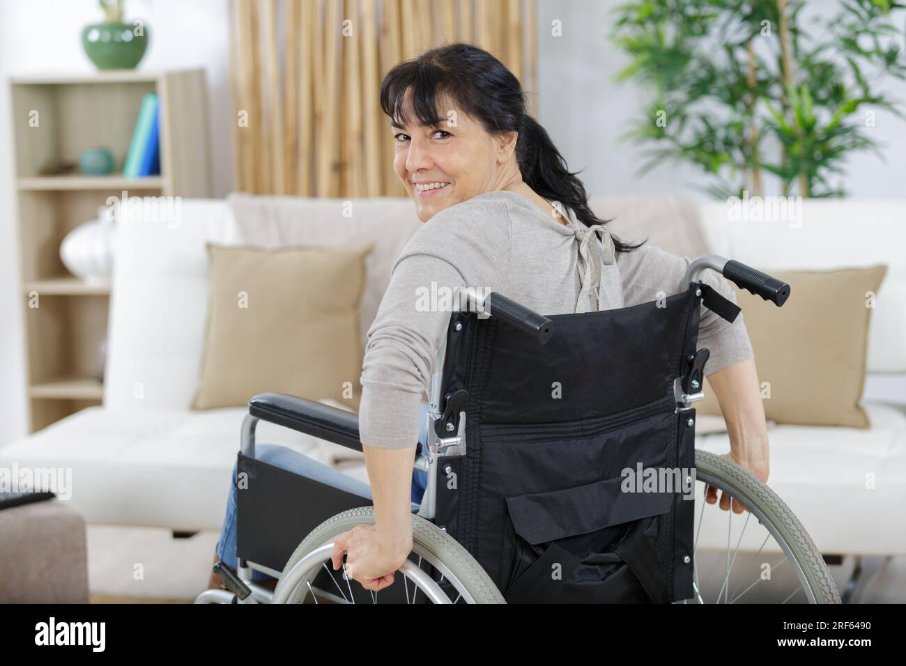 disabled woman in wheelchair looking back Stock Photo - Alamy