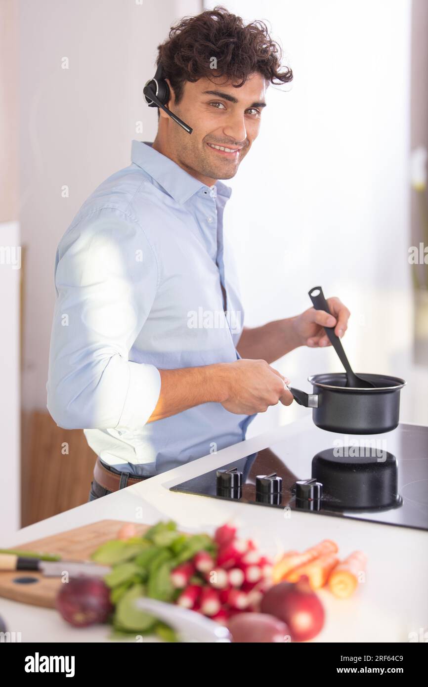 Multitasking woman cooking meal working hi-res stock photography and ...